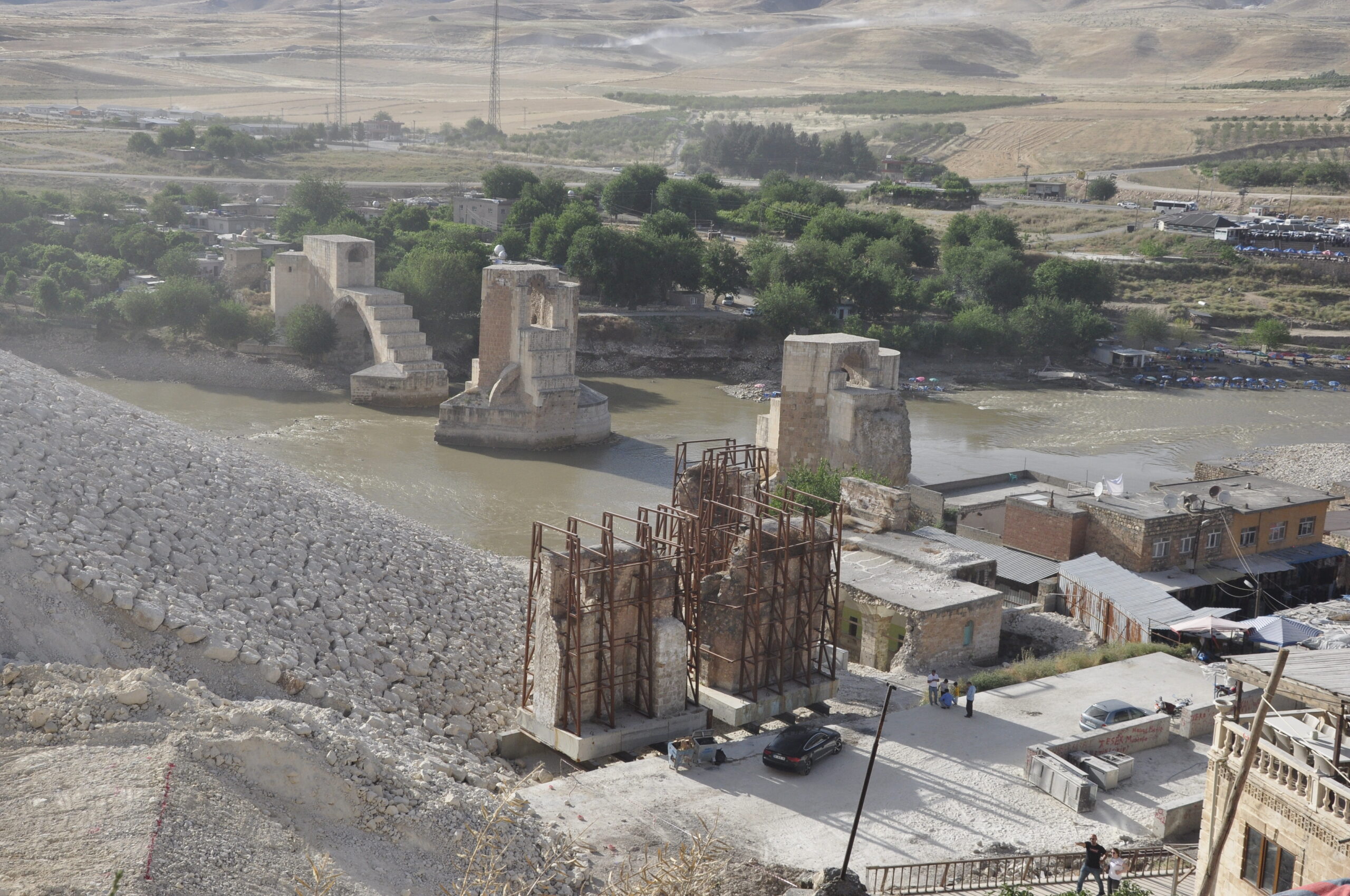 The old bridge with some old sections of wall being preserved - The ...