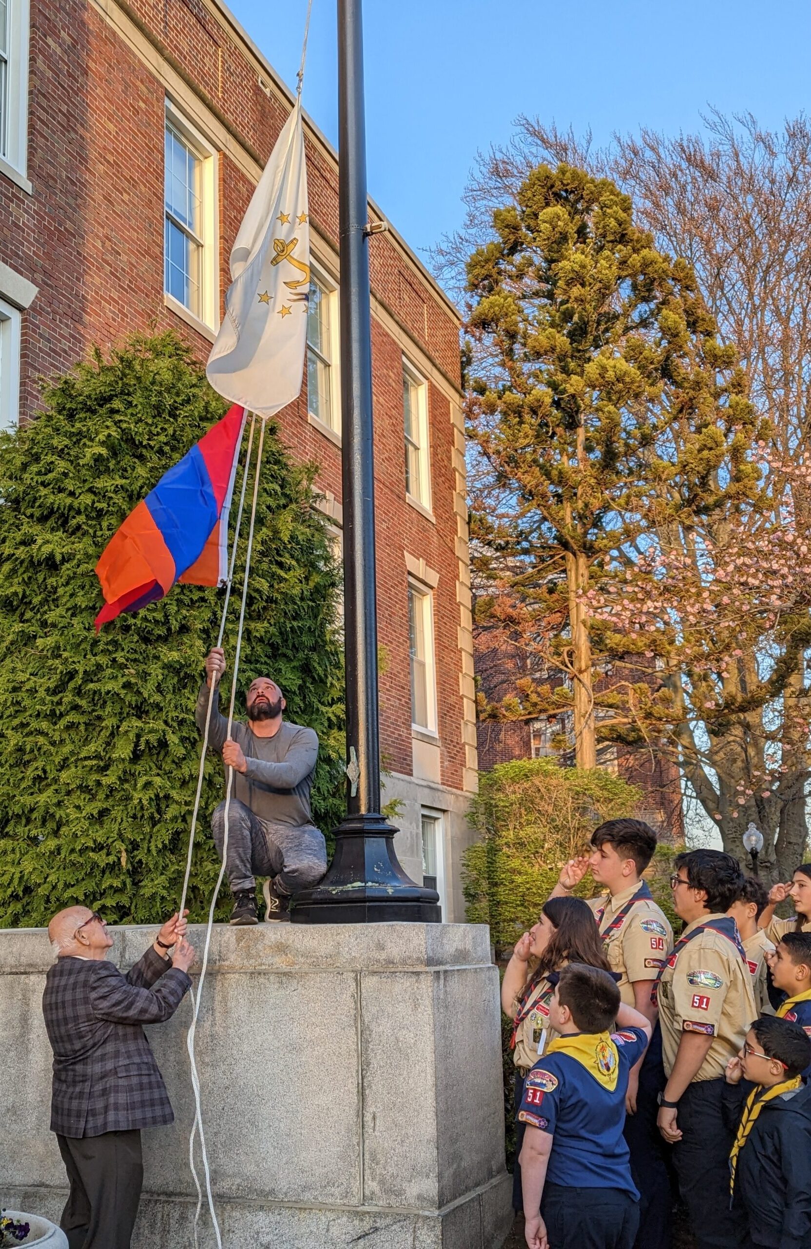 Jasper Bedrosian raising the Armenian flag as the Homenetmen Scouts ...
